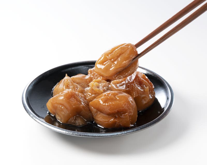 Japanese Pickled Plums and Freshly Cooked Rice Set Against a Wooden ...