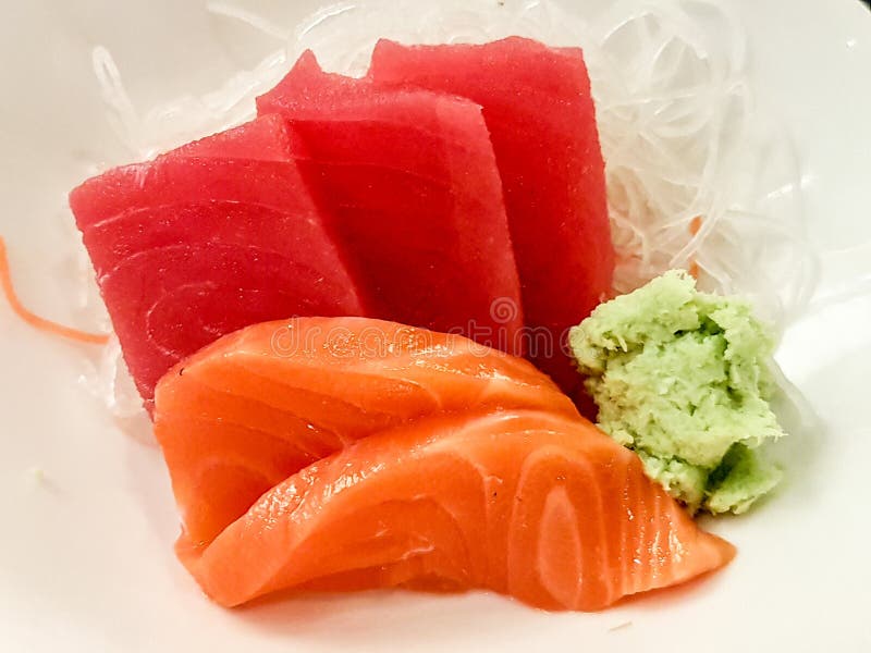 Japanese Raw Fish on White Plate and Marble Black Table. Also Known As ...