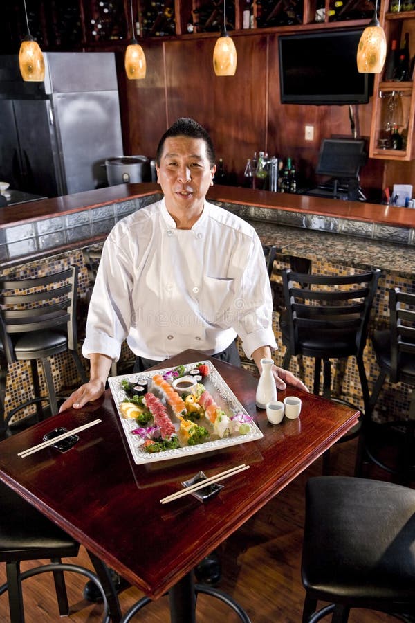 Japanese Sushi Restaurant, Chef Serving Customers Stock Photo - Image ...