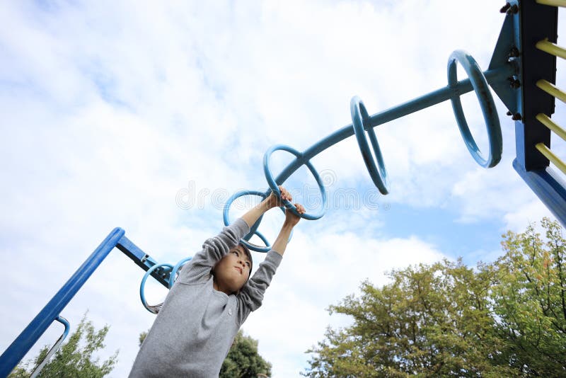 Japanese Student Girl Playing with a Monkey Bars Stock Photo - Image of ...
