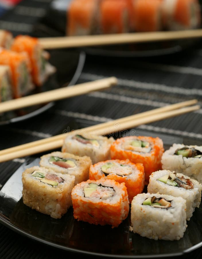 Teriyaki and Fried Chicken Sushi Rolls on Japanese Bamboo Mat with ...