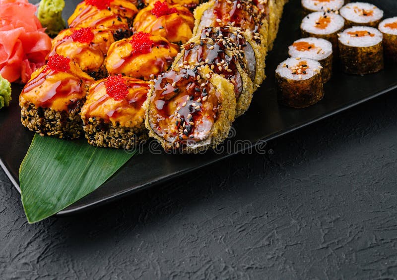 Japanese Sushi Assorted on a Black Stone Plate Stock Photo - Image of ...