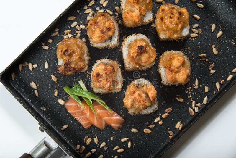 Japanese Sushi Rolls on a Black Frying Pan. Close View Stock Image ...