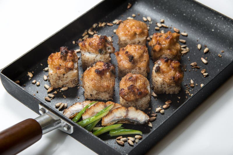 Japanese Sushi Rolls on a Black Frying Pan. Close View Stock Image ...
