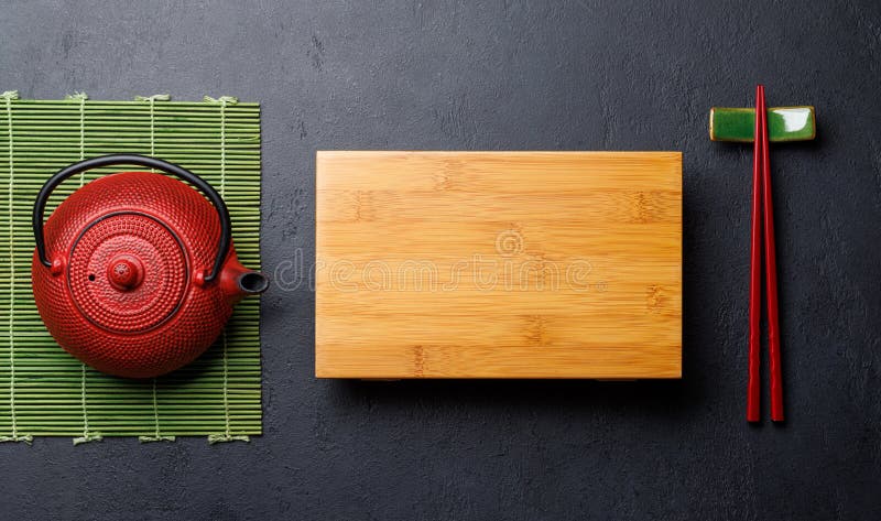 Japanese Table Setting with Wooden Board, Teapot, Chopsticks Stock ...