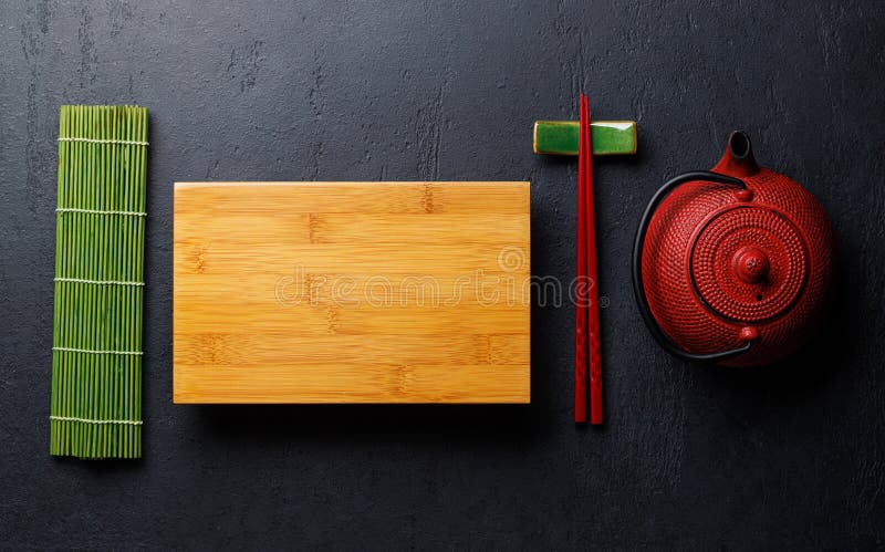 Japanese Table Setting with Wooden Board, Teapot, Chopsticks Stock ...