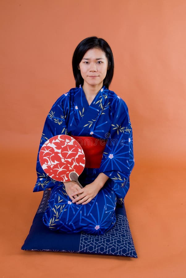 Japanese woman with fan stock photo. Image of cushion - 5504802