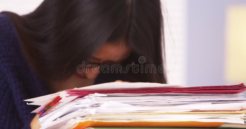 Woman is Overwhelmed by a Large Stack of Paper Files in Her Office and ...