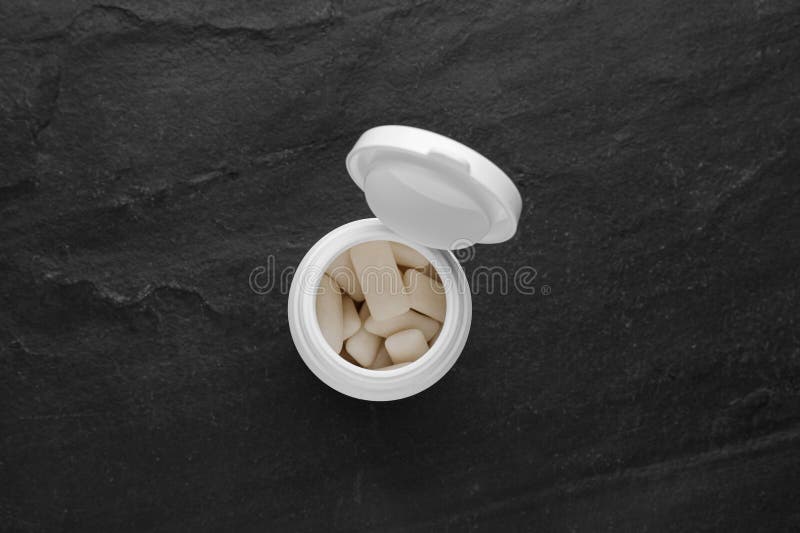 Jar with Chewing Gums on Black Table, Top View Stock Image - Image of ...