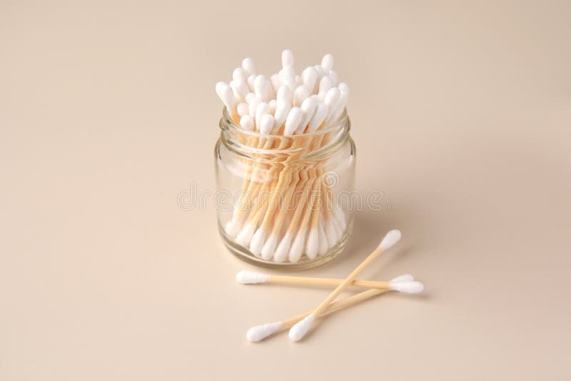 Jar and Clean Cotton Buds on Beige Background Stock Photo - Image of ...