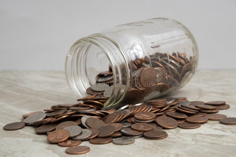 Coins spilling out jar stock image. Image of savings - 68332883