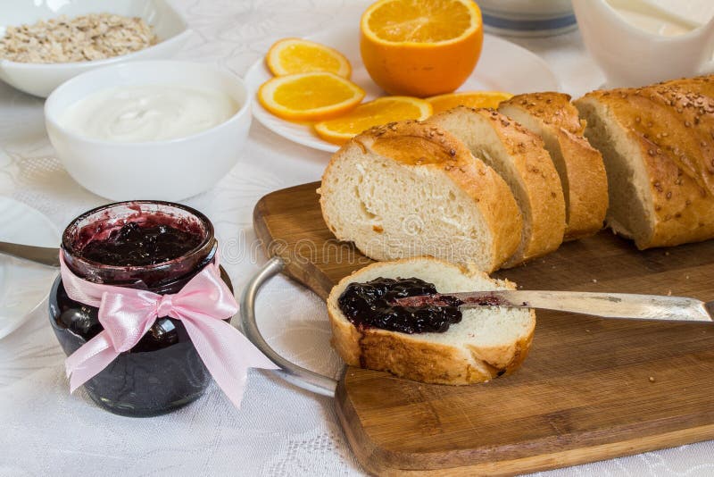 Jar of Currant Jam on Table with Loaf of Bread Stock Image - Image of ...