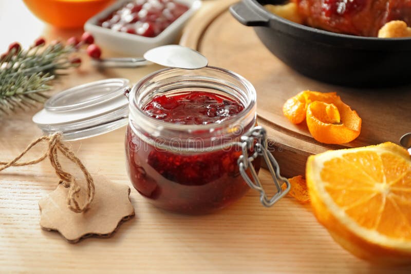 Jar with Delicious Cranberry Sauce and Products on Table Stock Photo ...