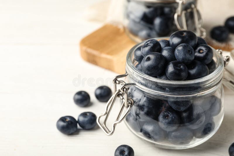 Jar of Fresh Acai Berries on White Wooden Table, Closeup View. Stock ...