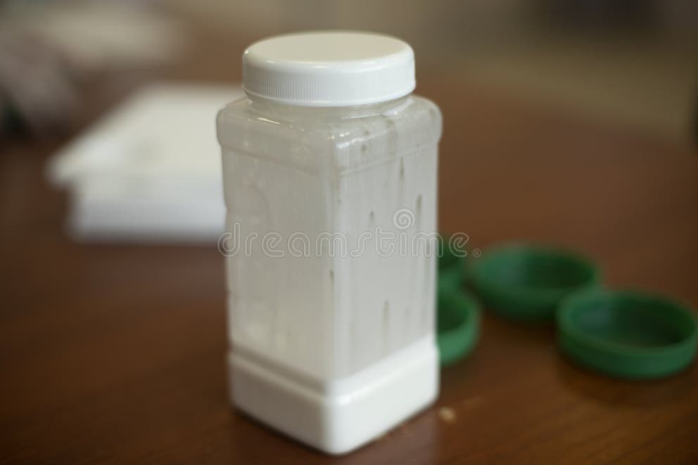 Jar with Glue. Glue on Table Stock Image - Image of glue, gloves: 283700267