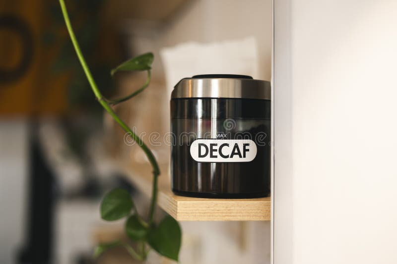 A Jar of Ground Coffee Labeled Decaf on a Shelf in a Coffee Shop. Stock ...