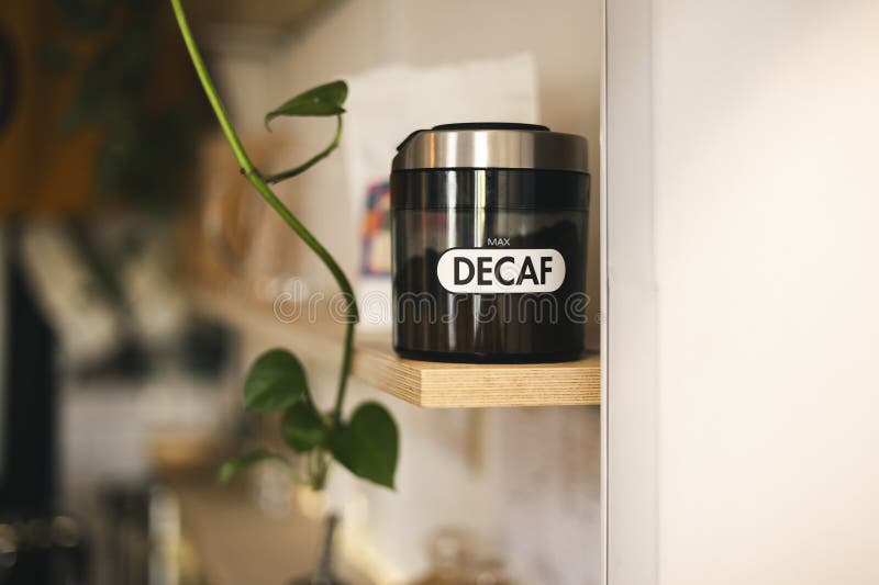 A Jar of Ground Coffee Labeled Decaf on a Shelf in a Coffee Shop. Stock ...