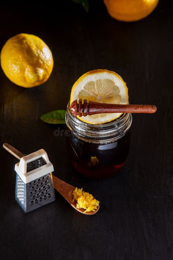 Jar of Honey and Cut Lemon, Vertical Stock Image - Image of plant, dark ...