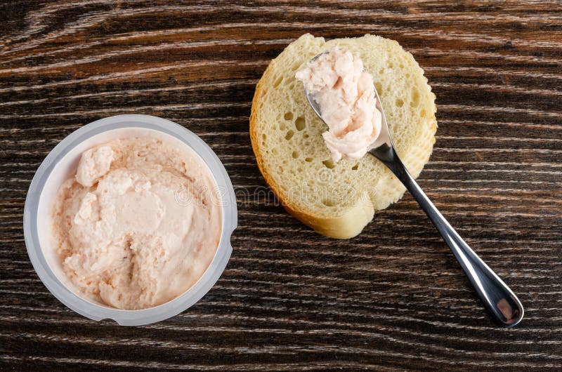 Jar with Krill Paste, Spoon with Paste on Piece of Bread on Table. Top ...