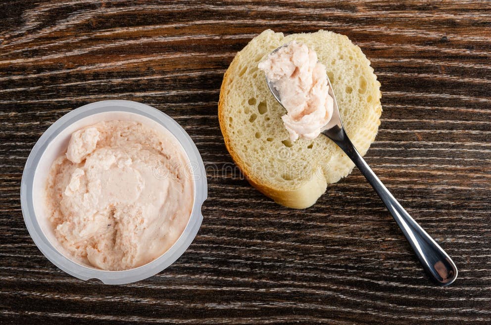 Jar with Krill Paste, Spoon with Paste on Piece of Bread on Table. Top ...