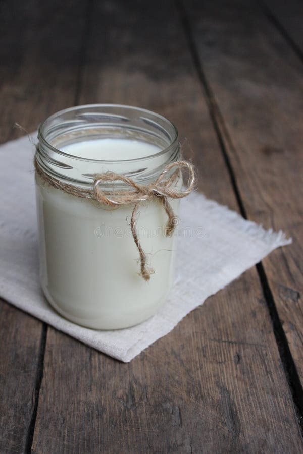 Jar with milk stock photo. Image of linen, wooden, milk - 62691450