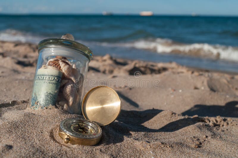 Jar with money and compass stock photo. Image of vacation - 70878766