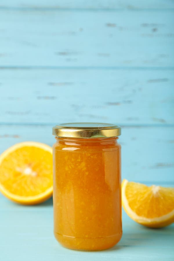 Jar of Orange Jam on Blue Background. Vertical Photo Stock Image ...