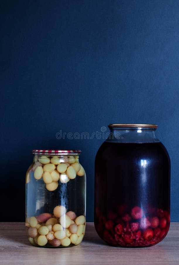 Jar of Raspberry, Cherry and Grape Juice on the Wooden Table in Front ...