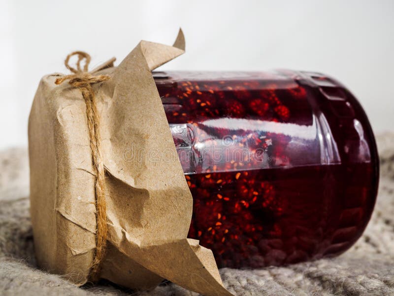 A Jar of Raspberry Jam on a Wool Blanket. Jam Jar Decorated with Kraft ...