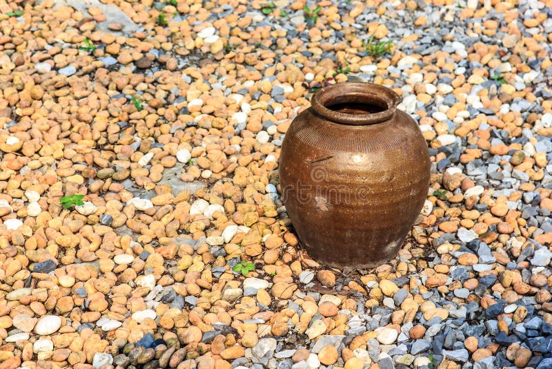 Jar on rocks stock photo. Image of craft, clay, brown - 29694016