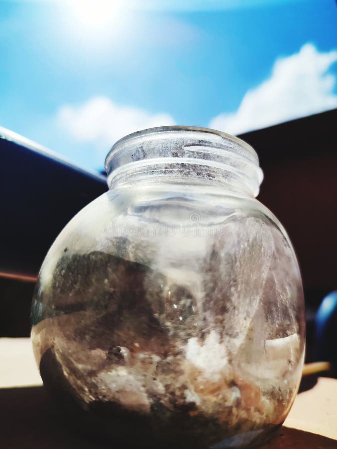 A Jar of Rocks Under the Sky Stock Image - Image of water, produce ...