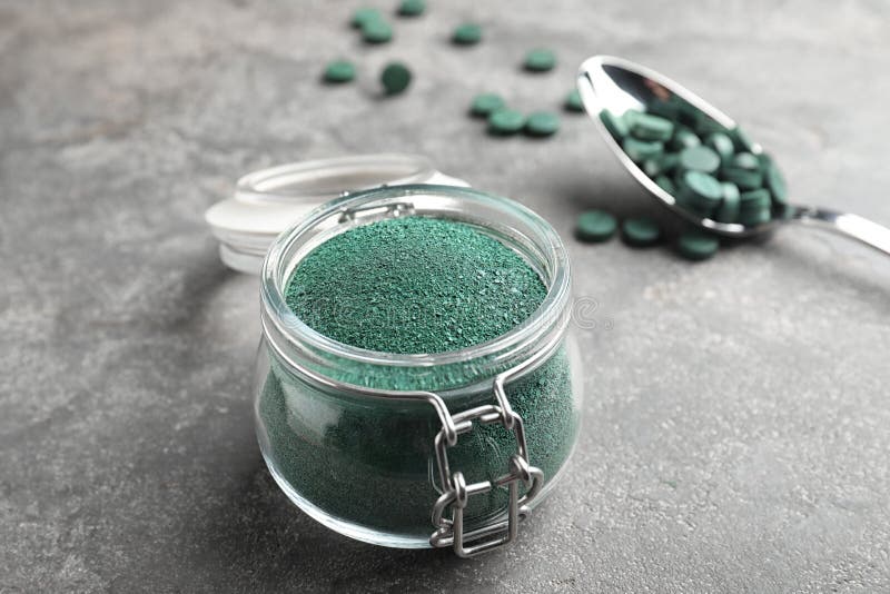 Jar of Spirulina Algae Powder on Table, Closeup. Stock Image - Image of ...