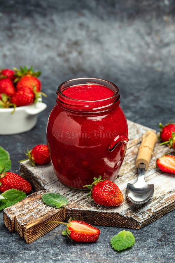 A Jar of Strawberry Jam on a Wooden Board, Vertical Image. Top View ...
