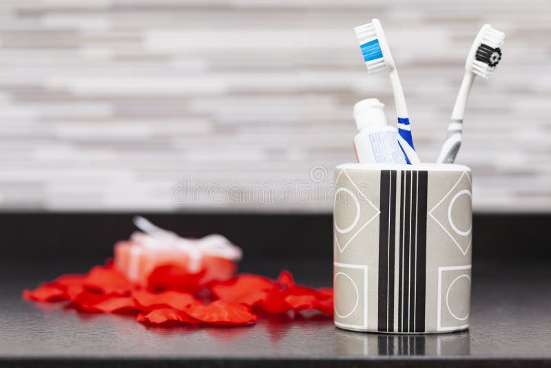 A Jar with Toothbrushes and Toothpaste Stock Image - Image of marble ...