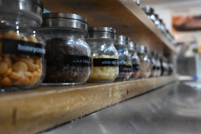 Jars with Assorted Nuts on Wooden Shelf in a Store Stock Image - Image ...