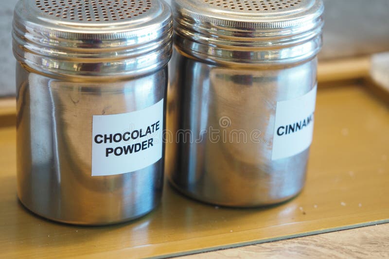 Jars of Chocolate Powder and Cinnamon on a Wooden Table Surface Stock ...