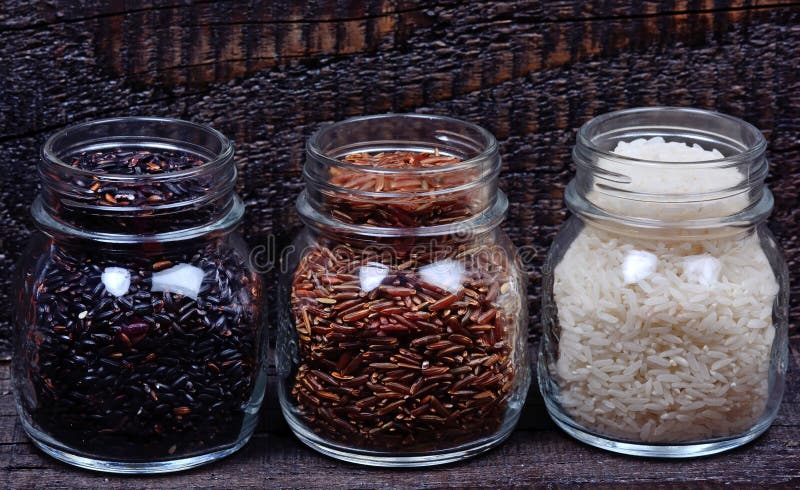 Jars with Different Types of Rice on Table Stock Image - Image of ...