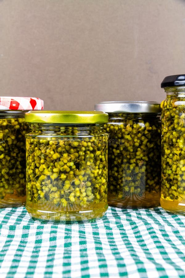 Jars of Pickled Wild Garlic Seed Capers Portrait Stock Image - Image of ...