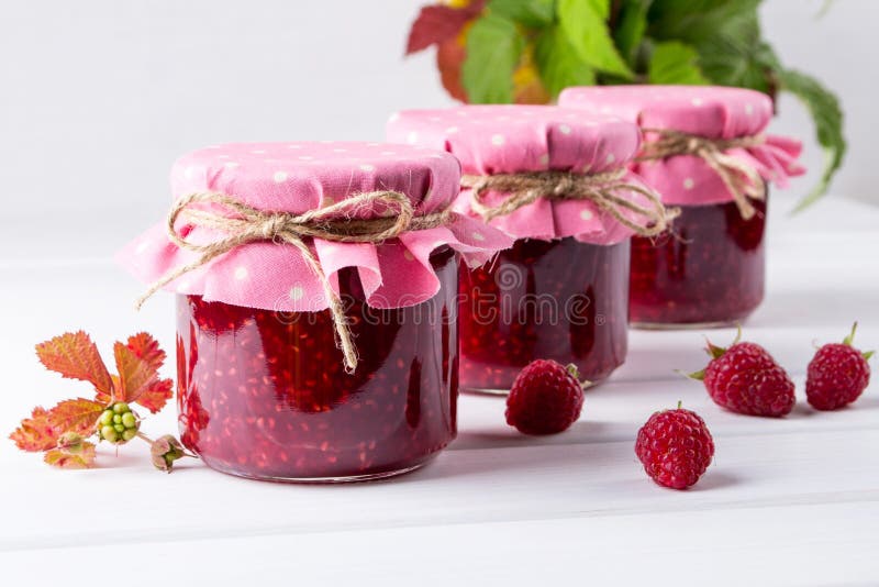 Jars with Raspberry Jam Placed in Rows and Fresh Raspberry Stock Photo ...