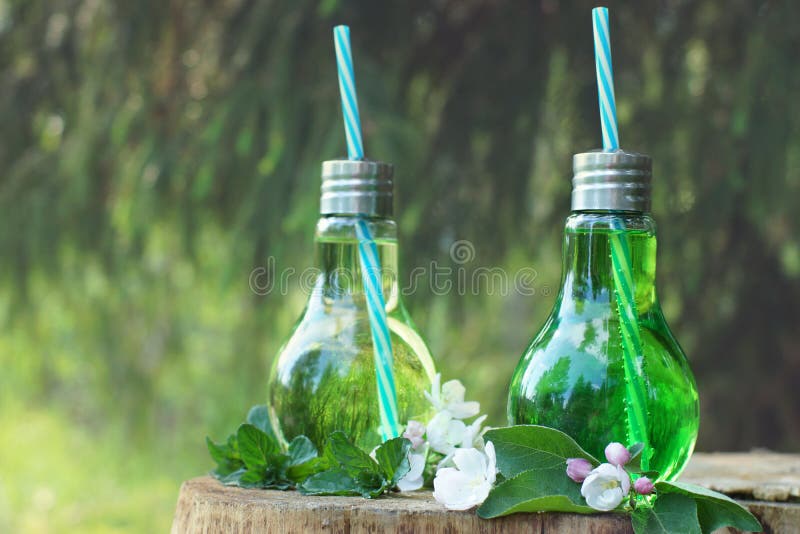 Jars with Straw on a Hemp Under a Tree, Inside a Carbonated Lemonade ...