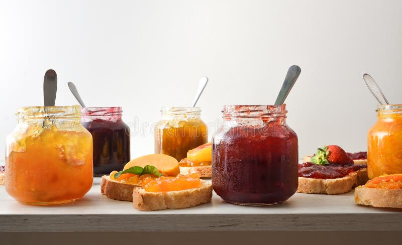 Jars and Toast with Jam of Various Flavors Isolated White Stock Photo ...