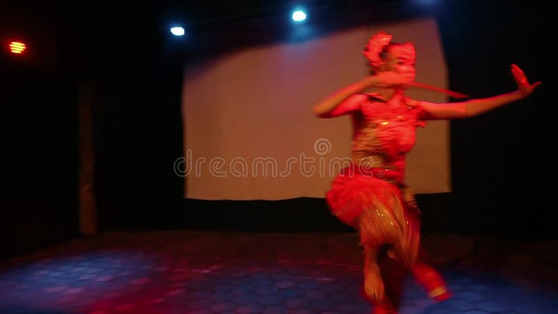 A Java Dancer Wearing a Traditional Costume while Dancing with the ...