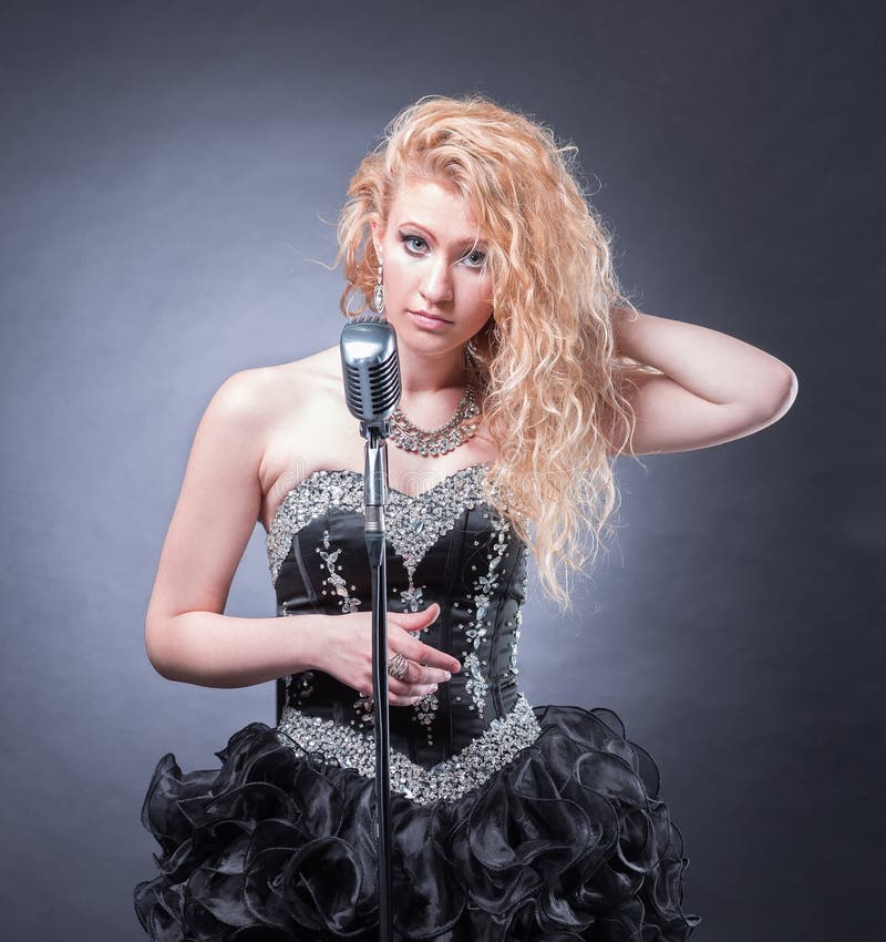 Jazz Singer Standing In Front Of The Microphone. Isolated Stock Image ...