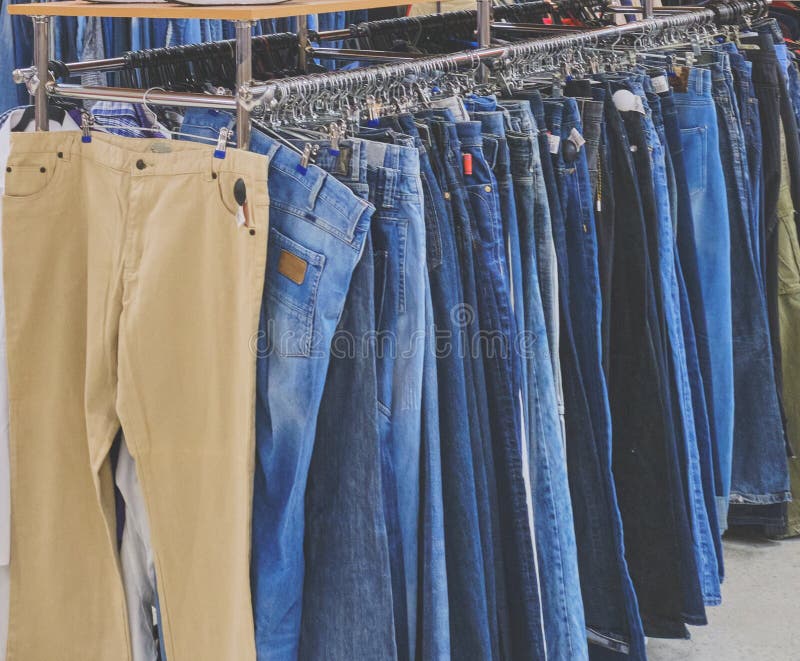 Jeans on Hangers, Second Hand Clothing Stock Photo - Image of minimal ...