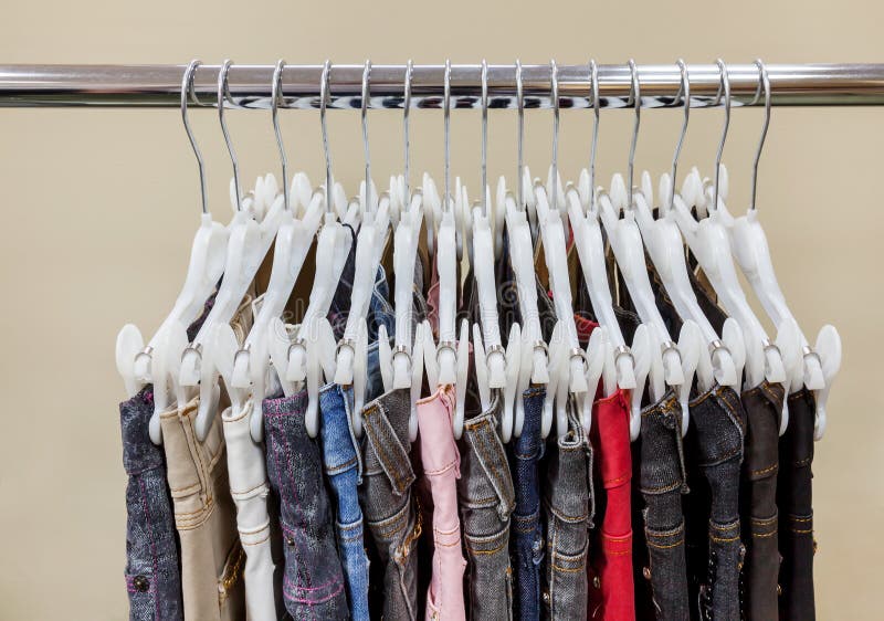 Jeans Hanging in Row on Hanger Stock Image - Image of material, pants ...