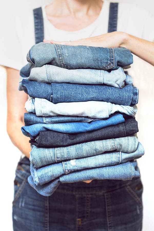 Jeans in her hands stock image. Image of concept, attractive - 124039475