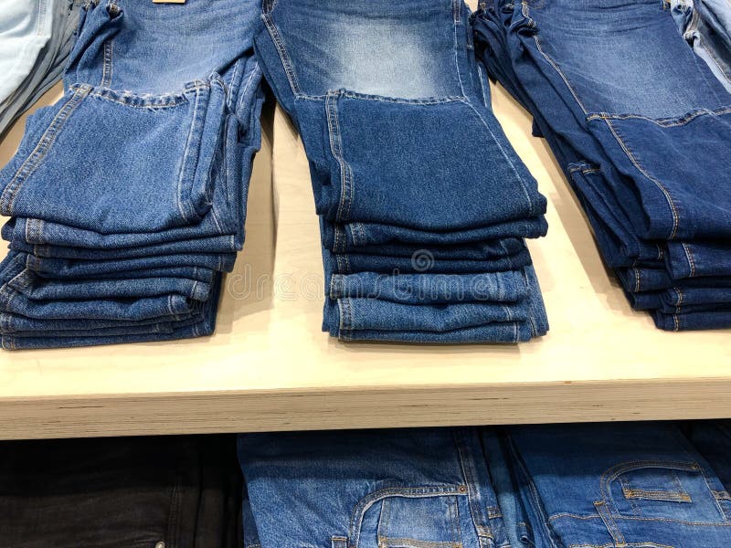 Jeans for Men on Sale in a Store Stock Photo - Image of dark, retail ...