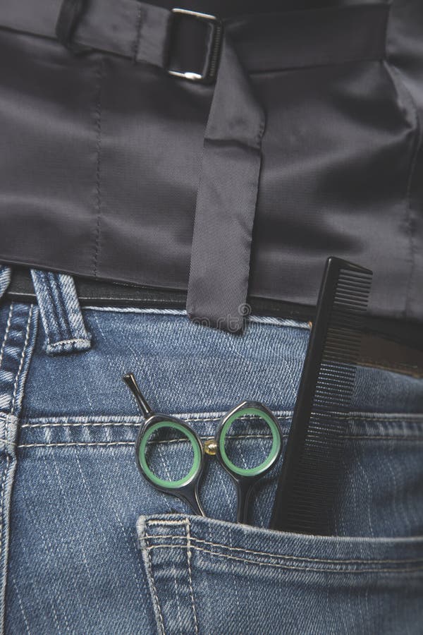 Jeans Pocket of a Barber with a Comb and Scissors Inside Stock Photo ...