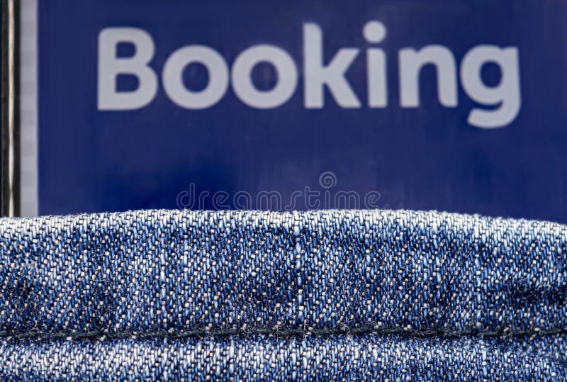 Jeans Pocket with Phone Screen with Booking. Com Application Sign ...