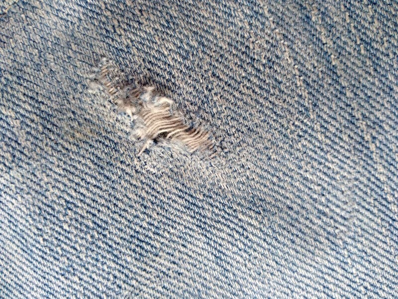Jeans Torn Denim Texture. Ripped Destroyed Jeans Background Stock Photo ...